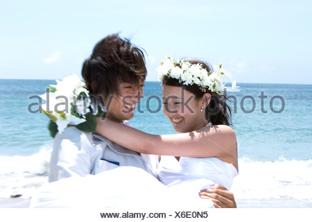 young groom carrying bride over threshold, portrait Stock Photo ...