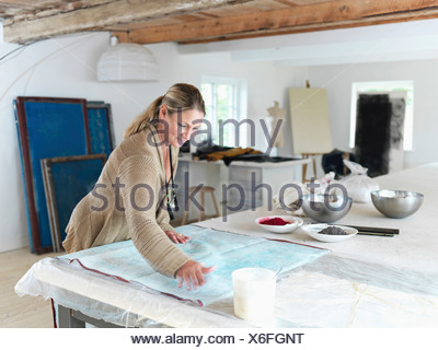 Female textile designer preparing textiles in design studio Stock Photo ...