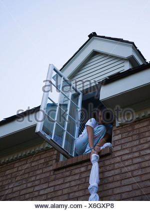 teenager climbing out of her bedroom window Stock Photo - Alamy