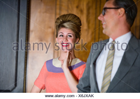 Vintage portrait of young secretary with beehive sitting in office ...