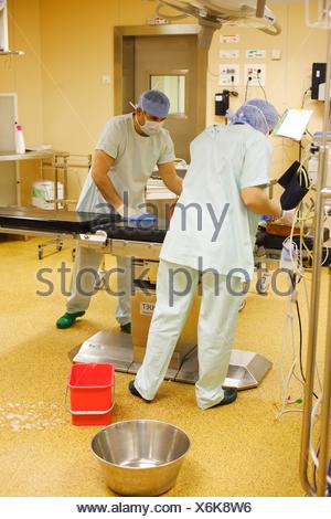 Hospital cleaning staff disinfecting operating room Stock Photo ...