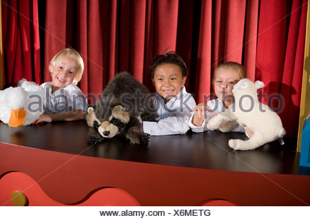 School kids doing puppet show in theatre at library Stock Photo ...