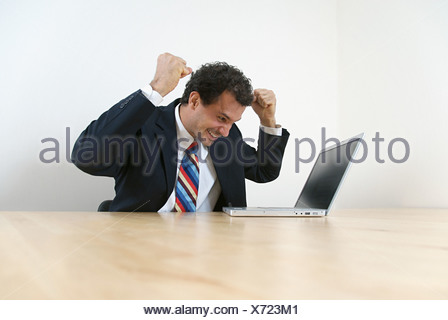 An elated businessman Stock Photo - Alamy