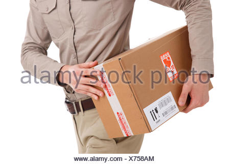 Portrait of delivery man running with package against gray background ...