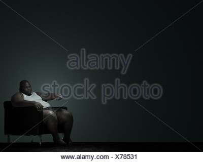 Fat man watching TV Stock Photo: 38063832 - Alamy