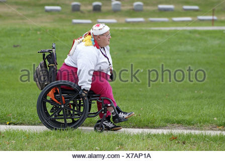 Obese overweight fat female is handicapped and rides in a wheelchair ...