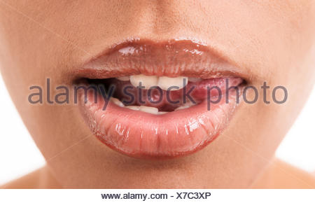 Young woman opening mouth for tongue depressor Stock Photo: 10597652 ...