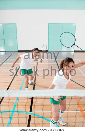 A boy and a girl playing badminton Stock Photo: 57144423 - Alamy