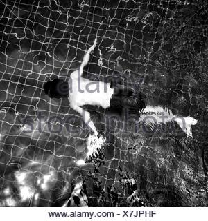 Swimming trunks floating on water surface Stock Photo - Alamy