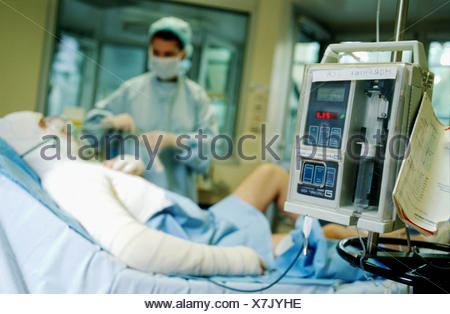 A severely burned patient manages pain treatment with a Stock Photo ...