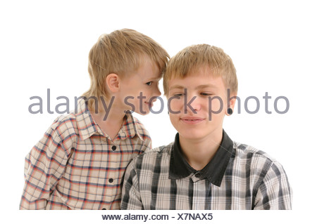 Two brothers embrace isolated on white background Stock Photo - Alamy