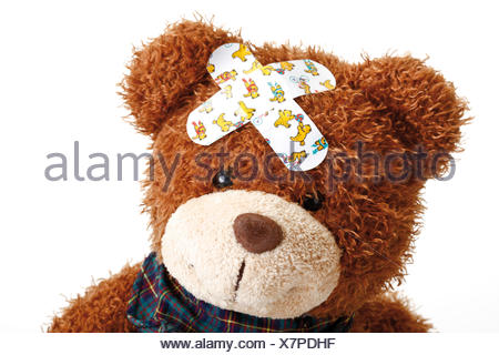 Teddy bear with band-aids on its head Stock Photo - Alamy