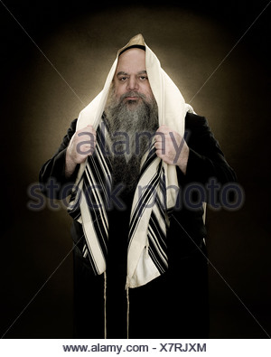 An Orthodox Jewish man wearing traditional clothing passionately Stock ...