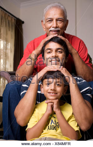 Indian family three generations sitting on swing India MR#364 Stock ...