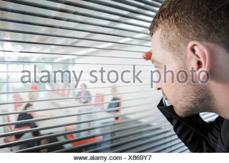 Mid-Adult Man Peering through House Window Stock Photo: 125938727 - Alamy