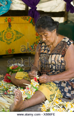 Tuvaluan women creating traditional flower head dresses, Funafuti Stock ...