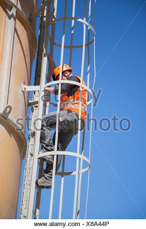 Man climbing ladder to sky Stock Photo: 49777736 - Alamy