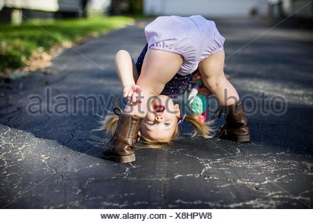 Rear view of children bending over looking at fishing net, Sanibel ...