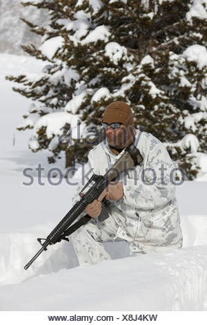 United States Marine holding an M-16 rifle during a combat operation ...