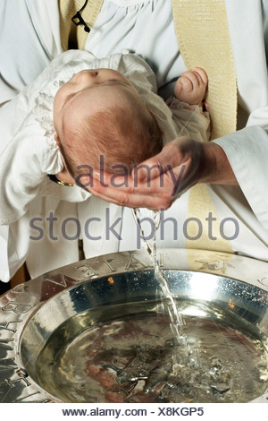 Pouring Water into Baptismal Font close up Stock Photo - Alamy