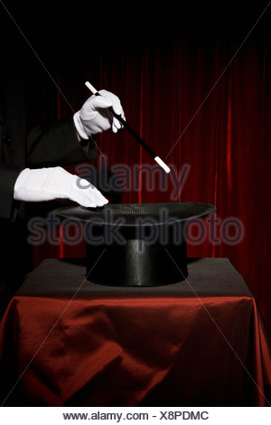 A magician's gloved hands performing a magic trick Stock Photo ...