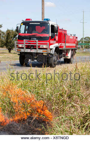 CFA fire fighters tackle a roadside fire near Shepperton, Victoria ...