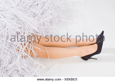 legs of young woman buried under shredded paper Stock Photo: 23220714 ...