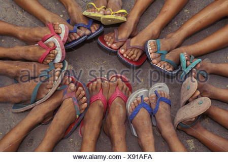 Woman with bare feet and colorful sandals and dress Stock Photo ...