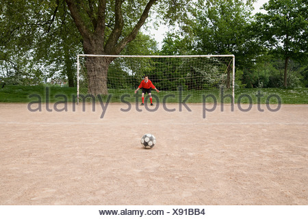 Goalkeeper standing in goal Stock Photo - Alamy