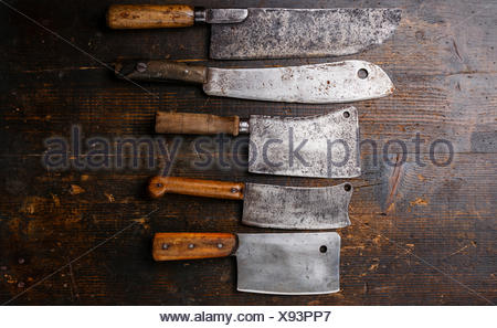 Vintage Butcher meat cleavers on dark wooden background Stock Photo ...