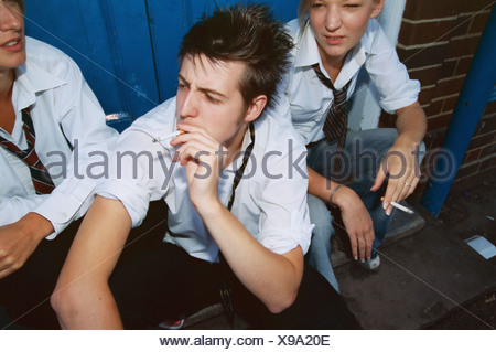 Small boy smoking a cigarette Stock Photo - Alamy