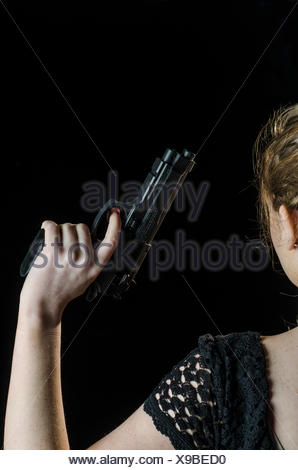 Back view of woman holding gun isolated on white background Stock Photo ...