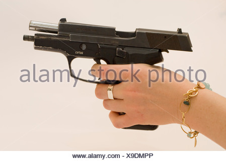 female hand holding gun aiming in subjective point of view POV isolated ...