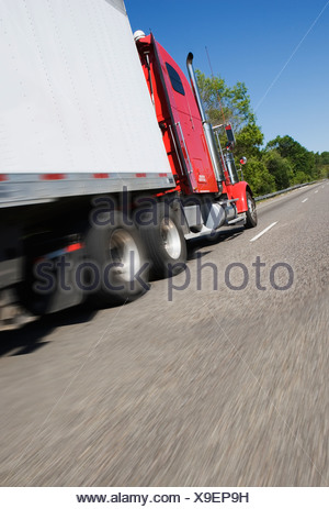 Side angle view of tractor trailer on highway Stock Photo: 9645359 - Alamy