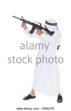 Happy Mature Islamic Man Holding Gun Over White Background Stock Photo ...
