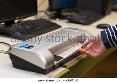 Person in laminating a pictorial expression Stock Photo: 103601395 - Alamy