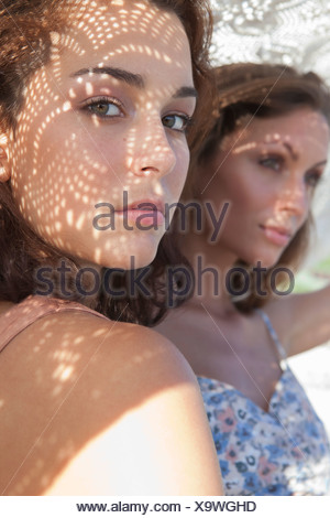Woman holding blanket over head Stock Photo - Alamy