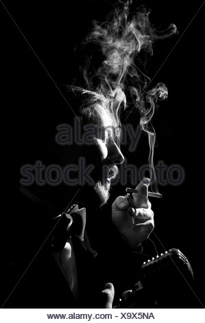 A male singer smoking a cigarette Stock Photo: 25705931 - Alamy