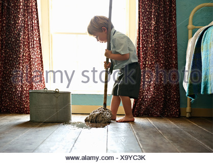 A boy mopping the floor Stock Photo: 47933208 - Alamy