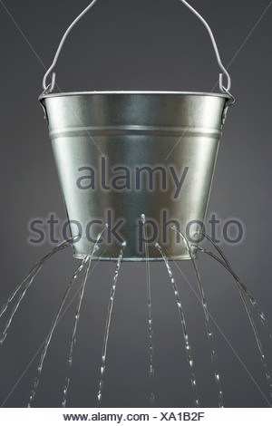 Studio shot of leaking bucket Stock Photo: 33805196 - Alamy
