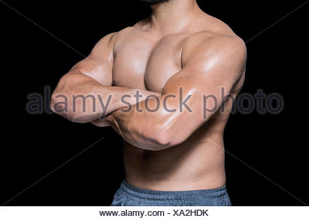 Mid section of a bodybuilder man with arms crossed Stock Photo ...
