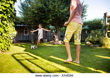 Brother and sister playing in backyard Stock Photo: 38126373 - Alamy