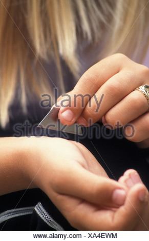 teenage girl cutting wrist with razor blade Stock Photo: 20697794 - Alamy
