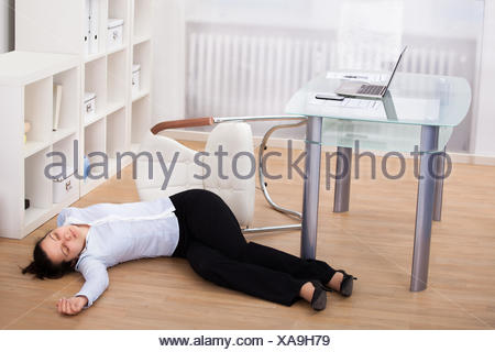 Exhausted Businesswoman Fainted On Floor At Workplace Stock Photo ...