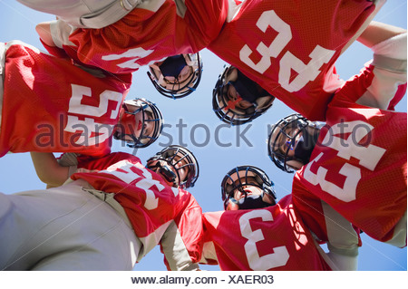 Football players huddle Stock Photo - Alamy