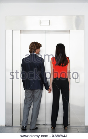 Colleagues flirting in elevator Stock Photo: 36910062 - Alamy