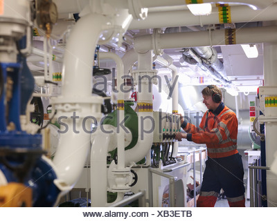 Marine engineer working in ship's workshop in engine control room Stock ...