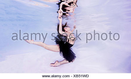 Underwater view of girl wearing tutu and ballet shoes Stock Photo - Alamy