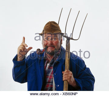 Studio portrait of farmer with pitchfork Stock Photo: 34159947 - Alamy
