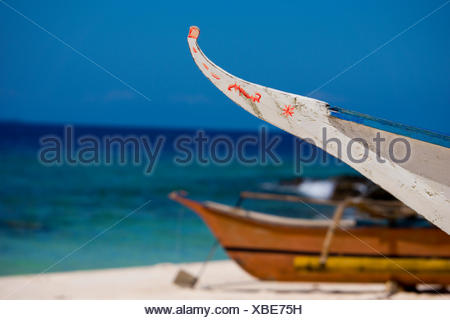 Banka, traditional Philippine outrigger boat off the beach Stock Photo ...